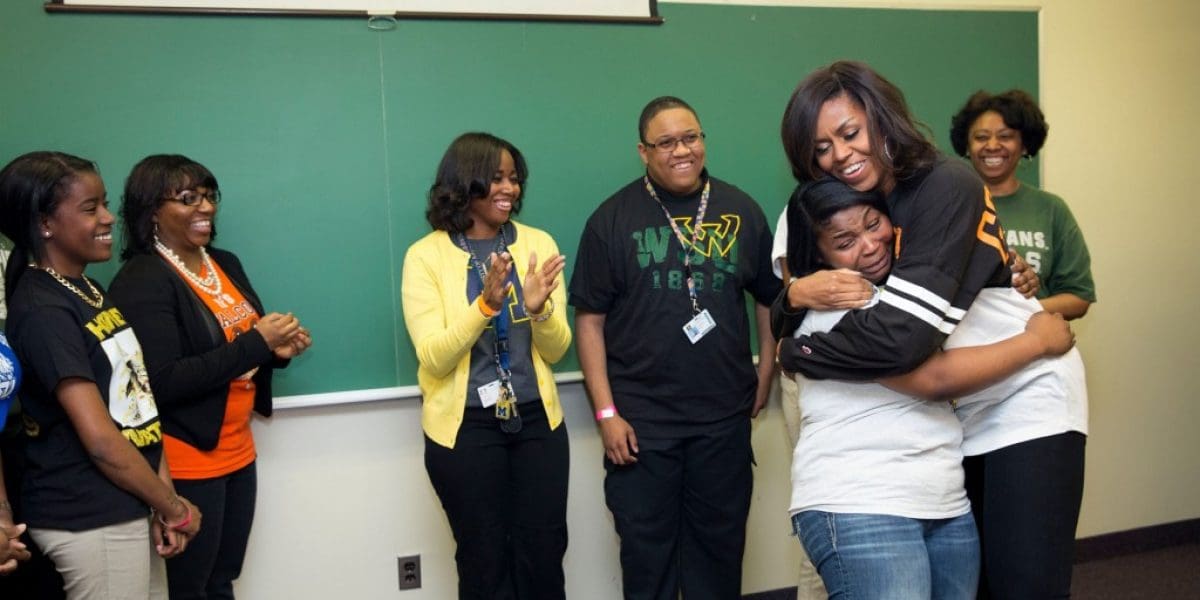 Michelle obama hug crying in schools - M2woman