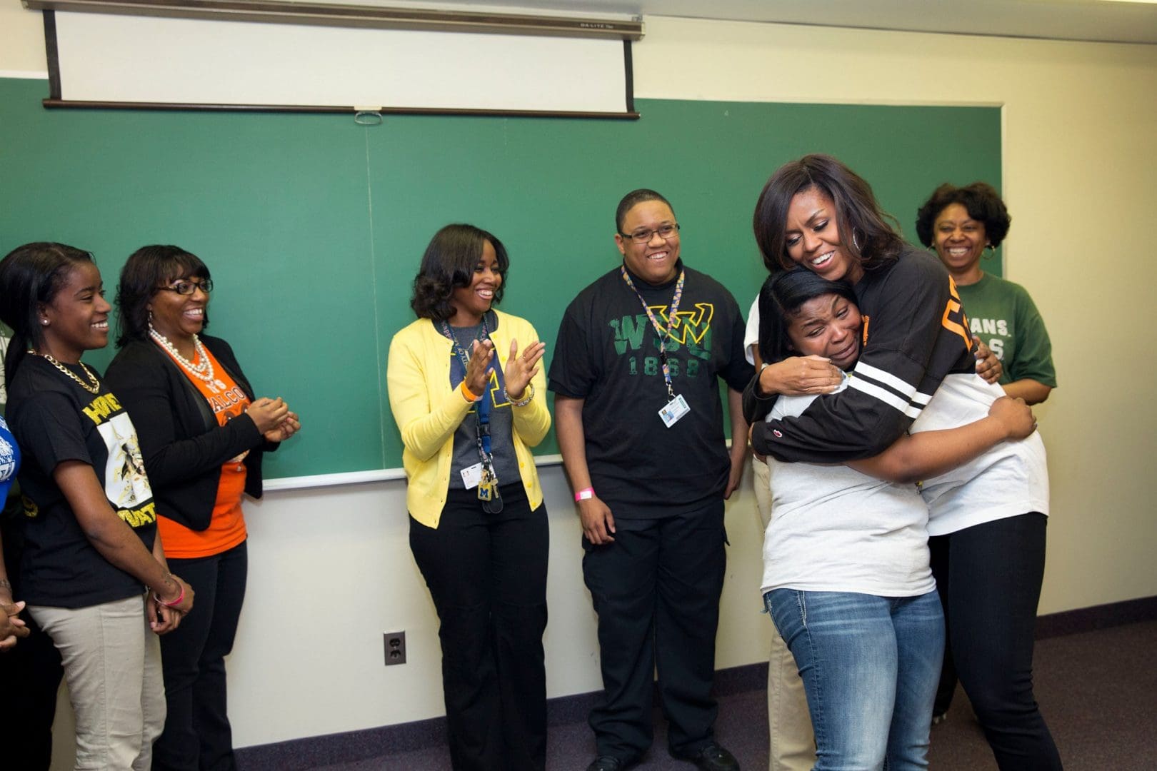Michelle obama hug crying in schools - M2woman